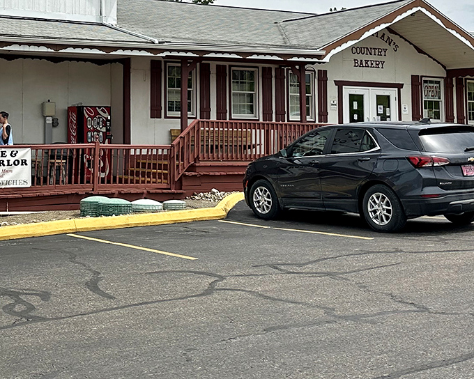 The charming exterior of Kauffman's Country Bakery beckons like a siren song to carb-lovers. That wooden porch has witnessed countless sugar-fueled pilgrimages.