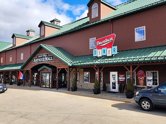 The rustic barn-like exterior of Berlin Village Antique Mall promises treasures within, like a wooden time capsule waiting to be opened.