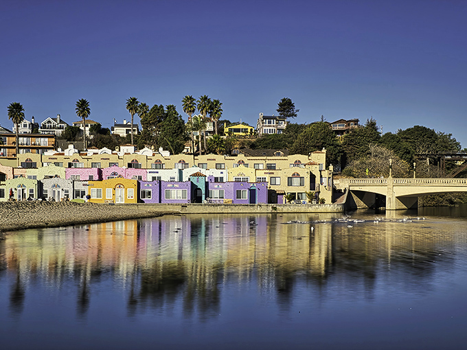 Morning light bathes the colorful waterfront homes in golden warmth, turning an ordinary Tuesday into a postcard-perfect moment.