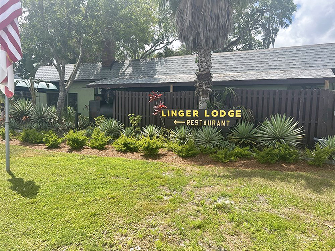 The unassuming entrance to Linger Lodge beckons with Old Florida charm, promising a dining adventure where taxidermy and tasty treats collide in delightful harmony.