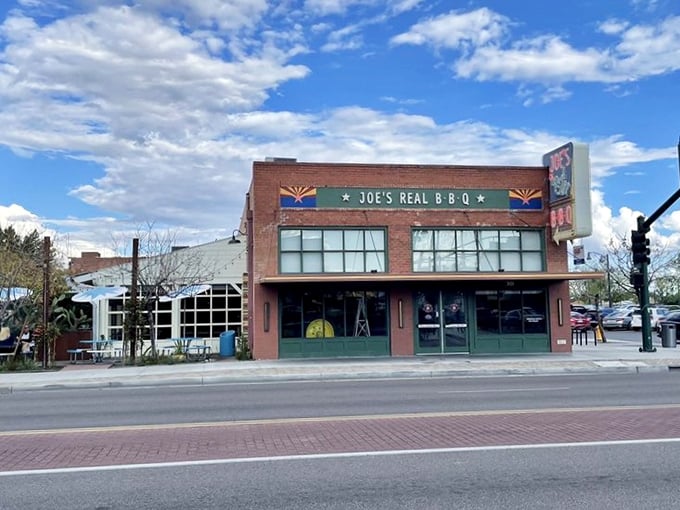 Arizona's flag colors crown this temple of smoke, where barbecue dreams come true under the desert sky.