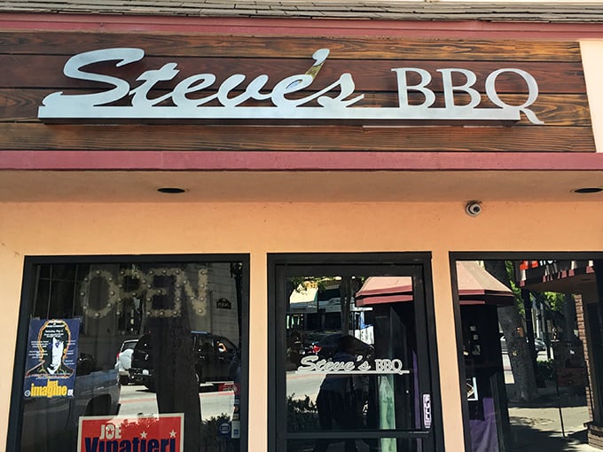 The wooden sign says it all &ndash; Steve's BBQ welcomes hungry visitors with rustic charm and the promise of smoky delights within.