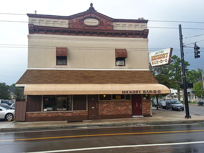 A second view reveals the historic character of this Dayton institution, where the tan awning and vintage signage hint at decades of barbecue tradition.