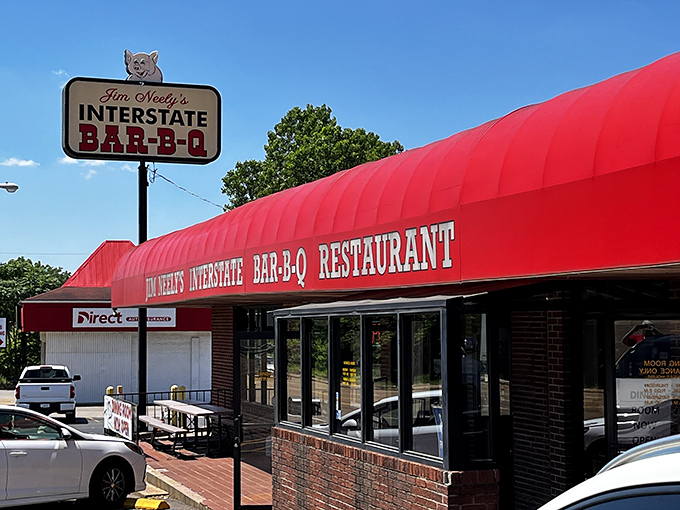 The iconic red awning of Jim Neely's Interstate Bar-B-Q stands as a beacon of smoky promise to barbecue pilgrims in Memphis.