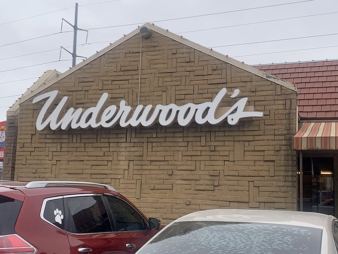 The iconic cursive "Underwood's" sign welcomes hungry pilgrims like a beacon of barbecue hope in the Texas landscape.
