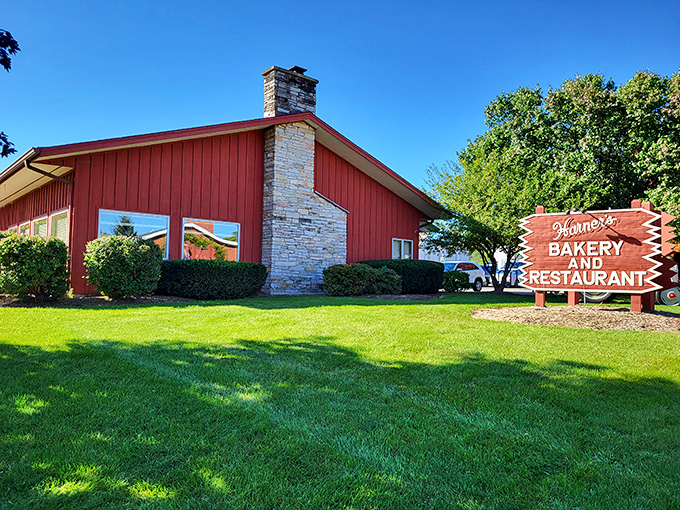 The iconic red barn exterior of Harner's stands like a beacon of comfort food promise along Route 31, complete with picnic tables for sunny day indulgence.