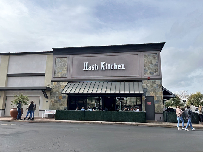 The iconic blue and black signage of Hash Kitchen beckons breakfast enthusiasts like a beacon of morning salvation in Scottsdale.