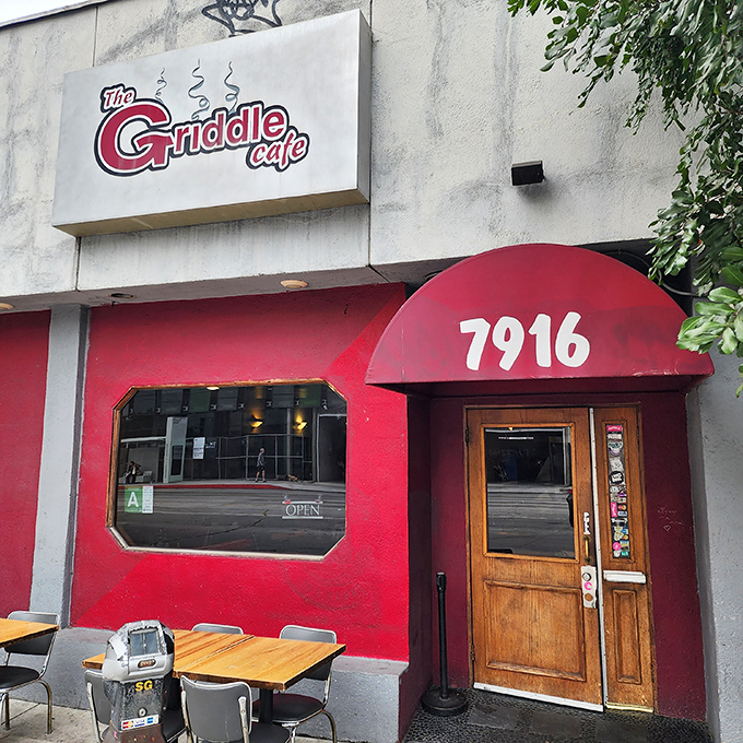 The iconic red facade of The Griddle Cafe beckons hungry breakfast pilgrims to this temple of pancake worship on Sunset Boulevard.