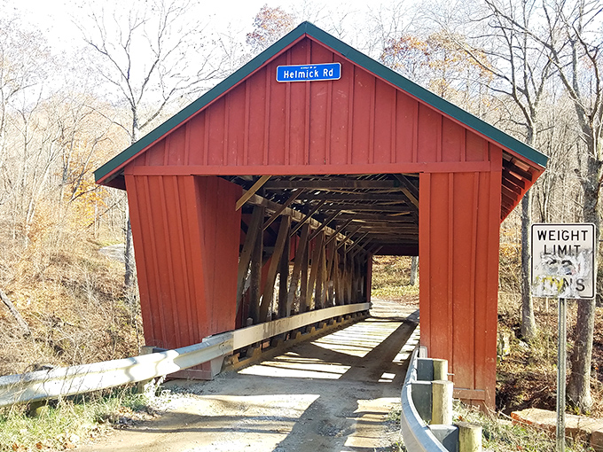 With its bold red fa&ccedil;ade and green roof, the Helmick Mill Bridge stands like nature&rsquo;s exclamation point against Ohio&rsquo;s quiet countryside&mdash;a postcard come to life.
