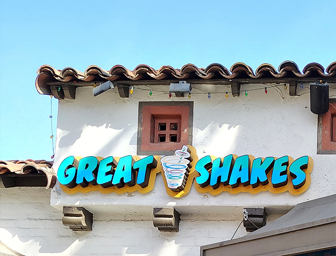 The iconic blue and brown signage of Great Shakes stands out against Palm Springs' white stucco, promising sweet relief from the desert heat.