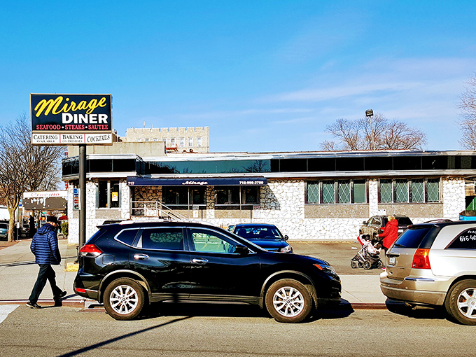 The iconic Mirage Diner sign beckons hungry travelers like a neon lighthouse in a sea of Brooklyn streets. Classic never goes out of style.