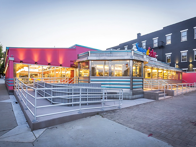 The pink palace of breakfast beckons! Sugar n' Spice's vibrant exterior lights up Sycamore Street like a neon promise of deliciousness to come.