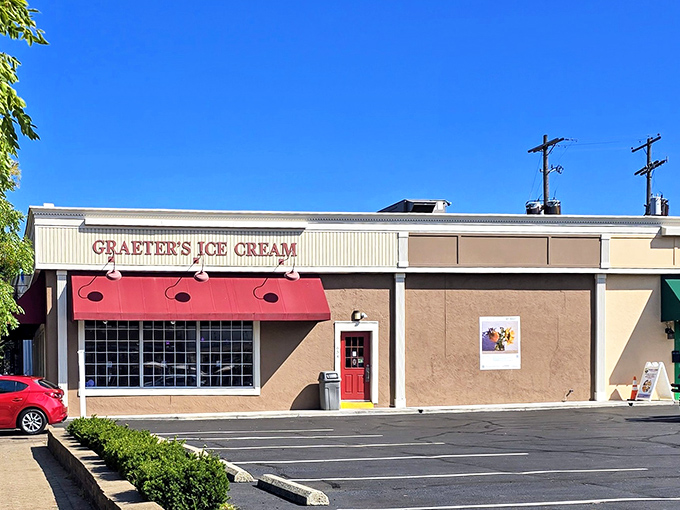 The iconic red awning of Graeter's beckons like a sweet siren call, promising frozen treasures within this unassuming Worthington storefront.