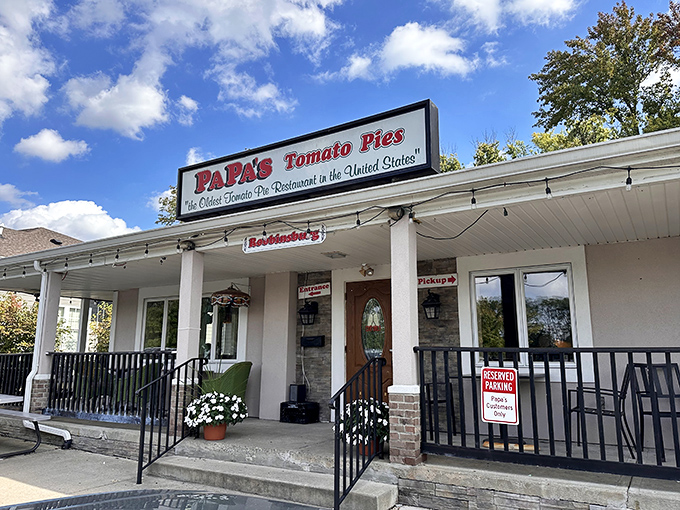 Bathed in New Jersey sunshine, this modest exterior belies the culinary treasures within. The "Oldest Tomato Pie Restaurant" claim isn't just marketing&mdash;it's documented history.