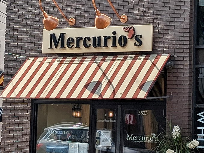 The iconic red and white striped awning of Mercurio's beckons like a culinary lighthouse on Walnut Street, promising authentic Italian delights within.