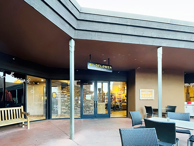 The modern exterior of Wildflower Bread Company beckons like an oasis for the carb-deprived traveler in Sedona's stunning landscape.