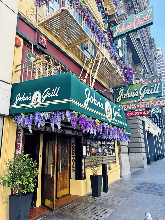 The iconic green awning of John's Grill beckons like an old friend, promising three essential food groups: steaks, seafood, and cocktails.