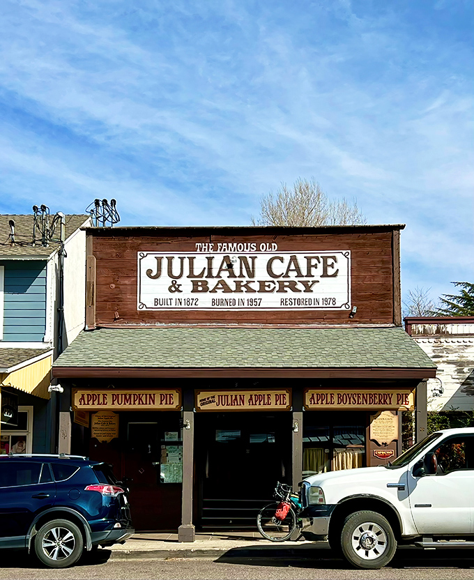 The iconic wooden storefront of Julian Cafe & Bakery stands like a time capsule on Main Street, inviting hungry travelers into its historic embrace.