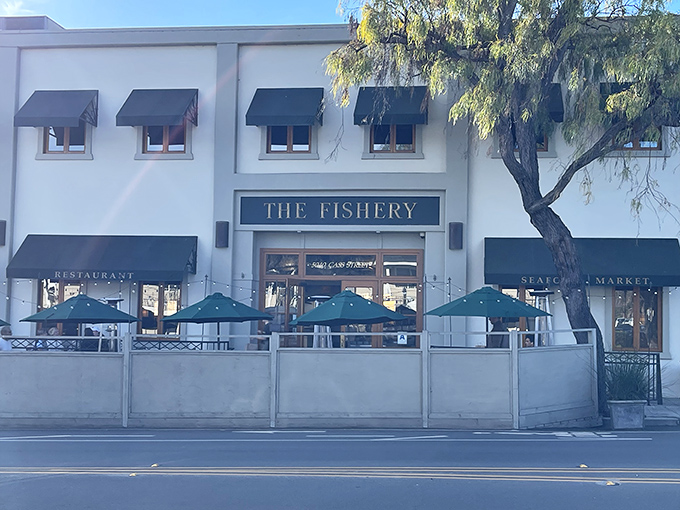 The Fishery's elegant white fa&ccedil;ade with teal umbrellas beckons like a maritime oasis in Pacific Beach. San Diego sunshine and seafood &ndash; a match made in coastal heaven.