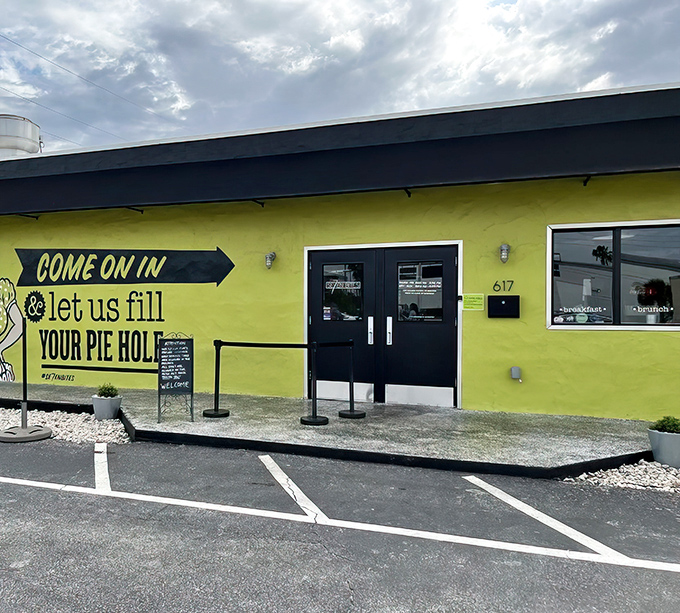 The lime-green exterior of Se7enBites isn't just a building—it's a declaration that boring breakfasts need not apply in this corner of Orlando.