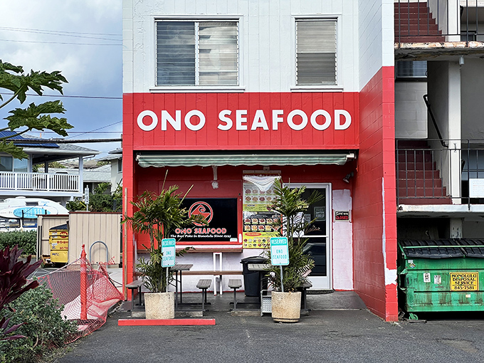 The bright red facade of Ono Seafood stands like a beacon of culinary promise on Kapahulu Avenue. Truth in advertising: "ono" really does mean "delicious" in Hawaiian.