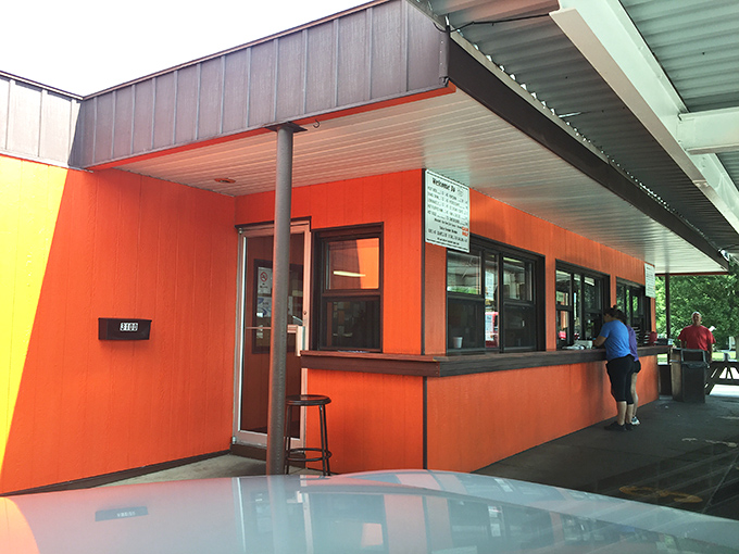 That vibrant orange exterior isn't just a building—it's a beacon of summer joy that's been calling Kalamazoo residents home for decades.