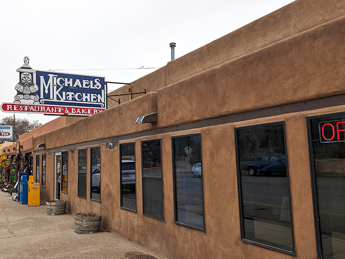 The classic adobe exterior of Michael's Kitchen stands as a beacon of comfort food in Taos, promising culinary treasures within those earthen walls.