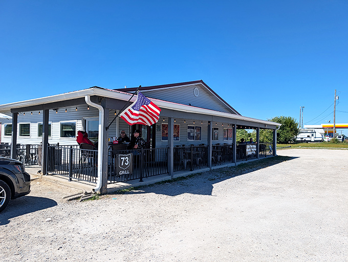 The unassuming exterior of 73 Grill in Wilmington, with its proudly waving American flag, promises honest food without pretense&mdash;the best kind of roadside discovery.
