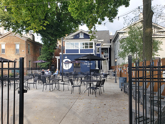 The inviting patio at The Swire Inn beckons with its charming tables and blue facade&mdash;Ohio's answer to European cafe culture.