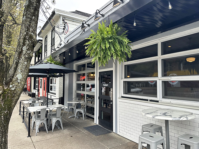 The Governor's crisp white exterior with lush hanging ferns creates the perfect first impression &ndash; like a modern diner dressed up for a fancy date.