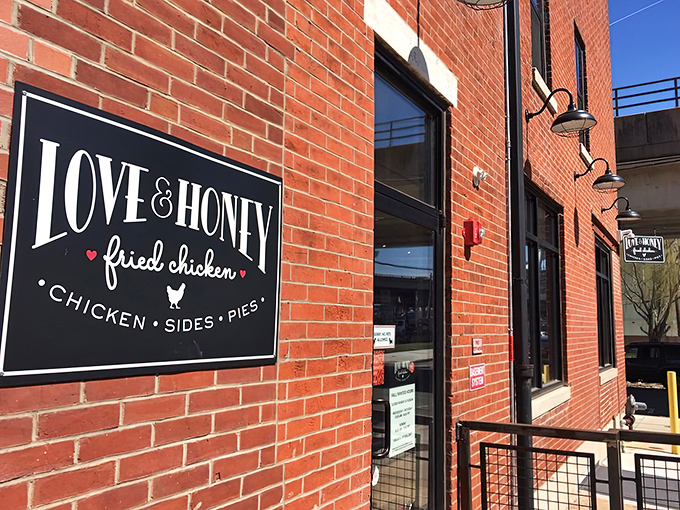 The iconic black and white sign against red brick announces Love & Honey's presence without fanfare&mdash;like all great food destinations, the flavors do the talking.