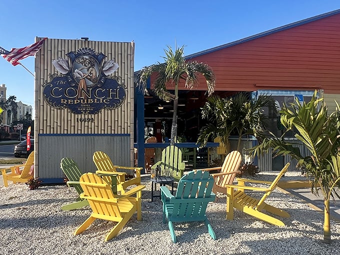 The vibrant exterior says "Florida vacation" louder than your uncle's Hawaiian shirt. Colorful Adirondack chairs invite you to slow down before the feast begins.