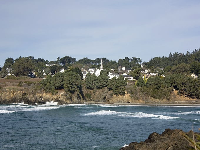 Perched dramatically on rugged cliffs, Mendocino's white Victorian homes stand like sentinels watching over the Pacific, a New England postcard somehow delivered to California's coast.