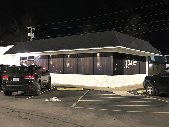 Carl & Chelle's unassuming exterior at night belies the culinary magic happening inside this Goldsboro steakhouse treasure.