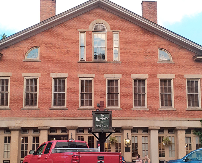 The historic brick fa&ccedil;ade of The Warehouse Restaurant stands proudly in Coshocton, where a rainbow occasionally appears as if to highlight this culinary treasure.