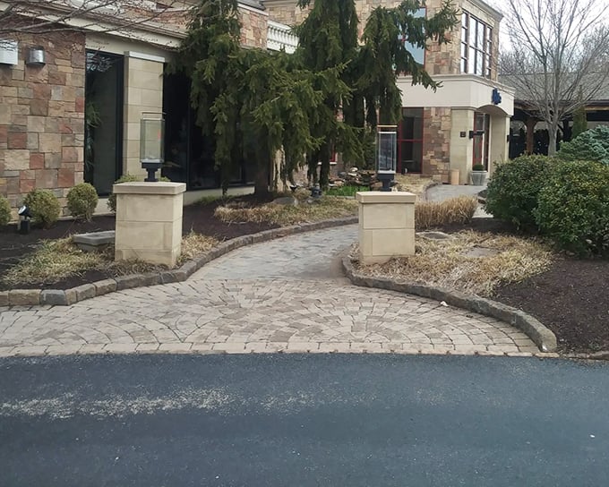 Stone pathways leading to gastronomic adventures &ndash; this entrance promises more than just a meal, but a full sensory journey.