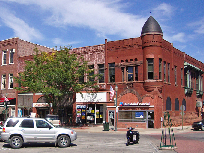 Centerville's historic downtown corner building stands like a sentinel of affordability, its distinctive turret watching over generations of sensible Midwestern spending habits. 