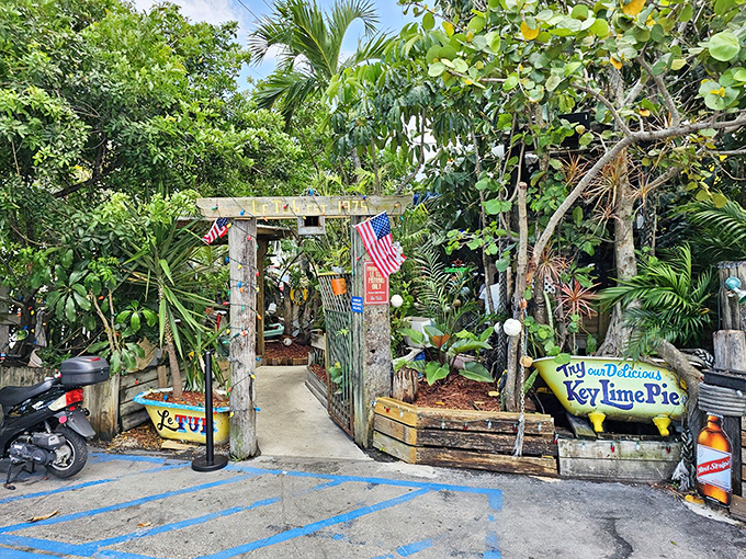 Behind this unassuming entrance lies burger paradise. Palm trees and a handmade sign welcome you to a Florida institution where culinary magic awaits.