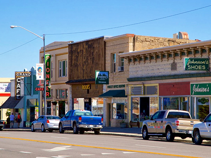 The Grand Cafe's neon sign beckons hungry travelers alongside Johnson's Shoes &ndash; a downtown where you can still get breakfast and practical footwear in the same block.