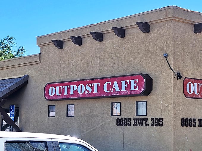That red sign isn't just announcing a restaurant—it's broadcasting a siren call to anyone with taste buds and an appreciation for roadside Americana at its finest.