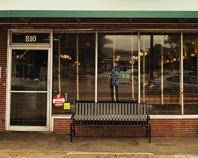 The unassuming storefront of Busy Bee Caf&eacute;, where Atlanta's soul food royalty has held court since 1947. That bench outside has witnessed more food anticipation than a Thanksgiving kitchen.