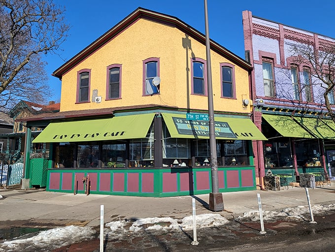 That distinctive yellow building with green awnings isn't trying to be trendy&mdash;it's too busy being exactly what a neighborhood cafe should be.