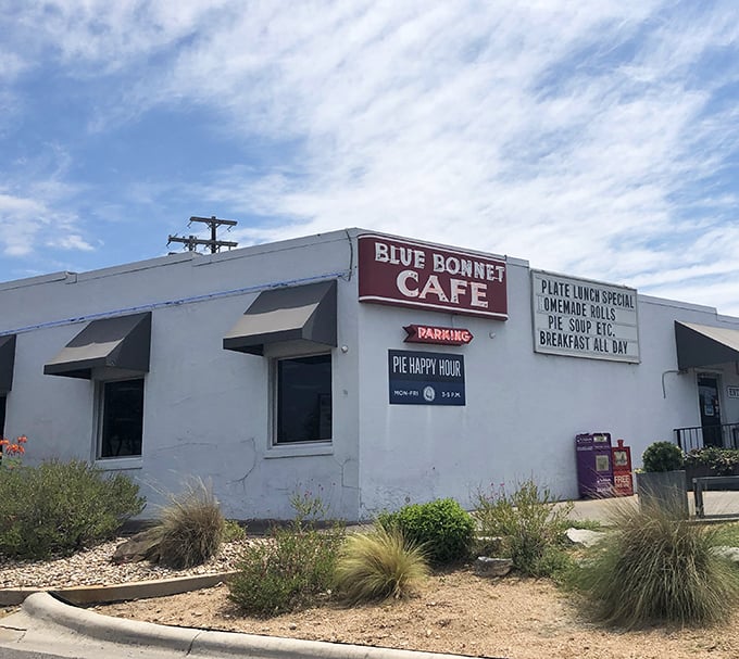 The unassuming exterior of Blue Bonnet Cafe stands like a culinary lighthouse in Marble Falls, beckoning hungry travelers with promises of homestyle cooking and pie happy hours.
