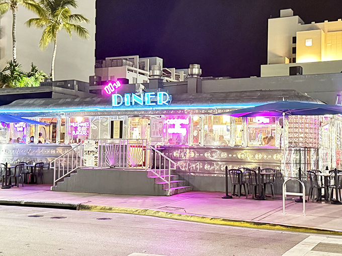 The neon-lit exterior of 11th Street Diner glows like a beacon of nostalgia against Miami Beach's night sky, promising comfort food and time travel in equal measure.