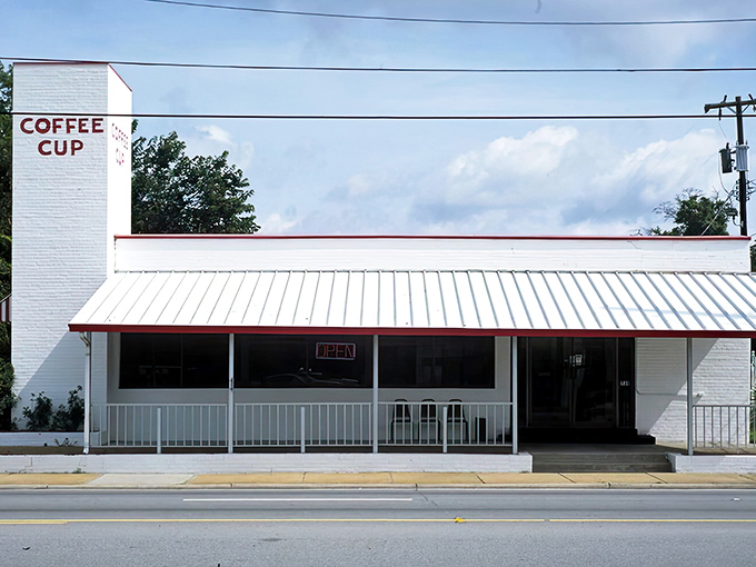 The unassuming white exterior with classic red trim says everything you need to know: this place cares more about what's on your plate than impressing Instagram.