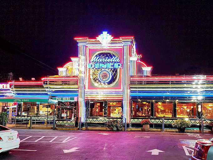 The Marietta Diner's neon glow could guide ships at sea. At night, this landmark transforms into a beacon of culinary comfort that Vegas would envy.