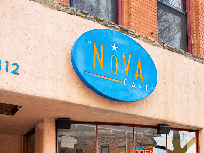 The iconic blue Nova Caf&eacute; sign beckons hungry Bozeman locals like a breakfast lighthouse guiding ships to delicious harbor.