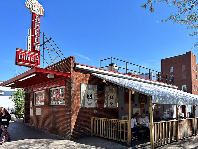 The iconic Red Arrow Diner stands proudly in Manchester, its vintage brick exterior and glowing neon sign beckoning hungry travelers like a lighthouse for the breakfast-deprived.