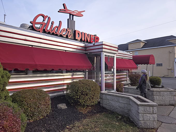 The iconic Glider Diner sign welcomes hungry travelers with its vintage airplane perched proudly above. Classic Americana at its finest!