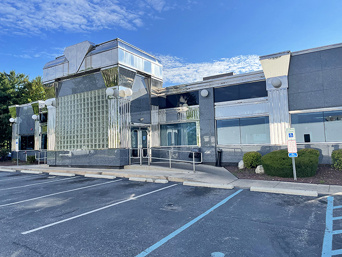 The gleaming silver-gray exterior of Springfield Diner stands like a time capsule of Americana, promising comfort food treasures within those glass block windows.